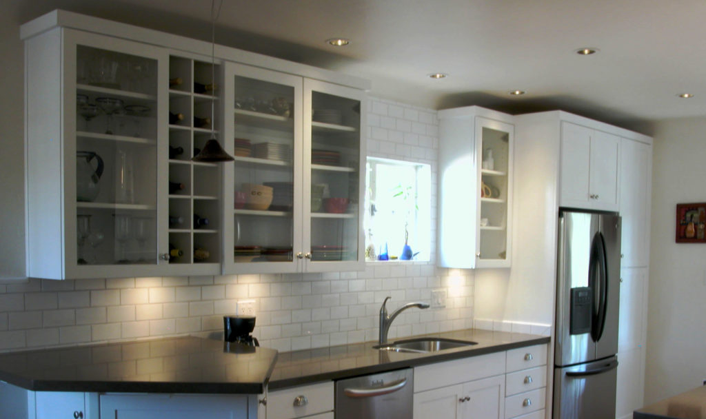 Upgrading your kitchen or bathroom with glass-paneled cabinet doors ...